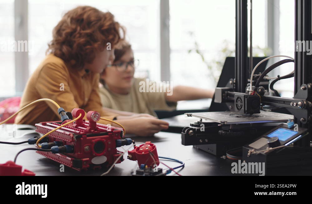 Two Intelligent Schoolchildren Programming Robot Using Laptop Stock ...