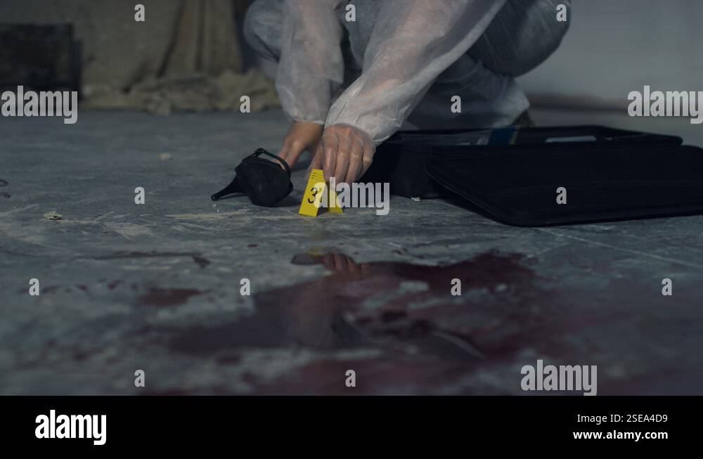 Wide Shot of Forensic Placing Evidence Tag Next to High Heel at Crime ...