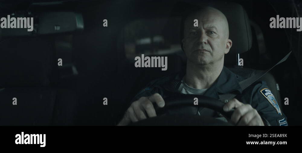 Caucasian police officer patrolling streets of neighborhood in patrol ...