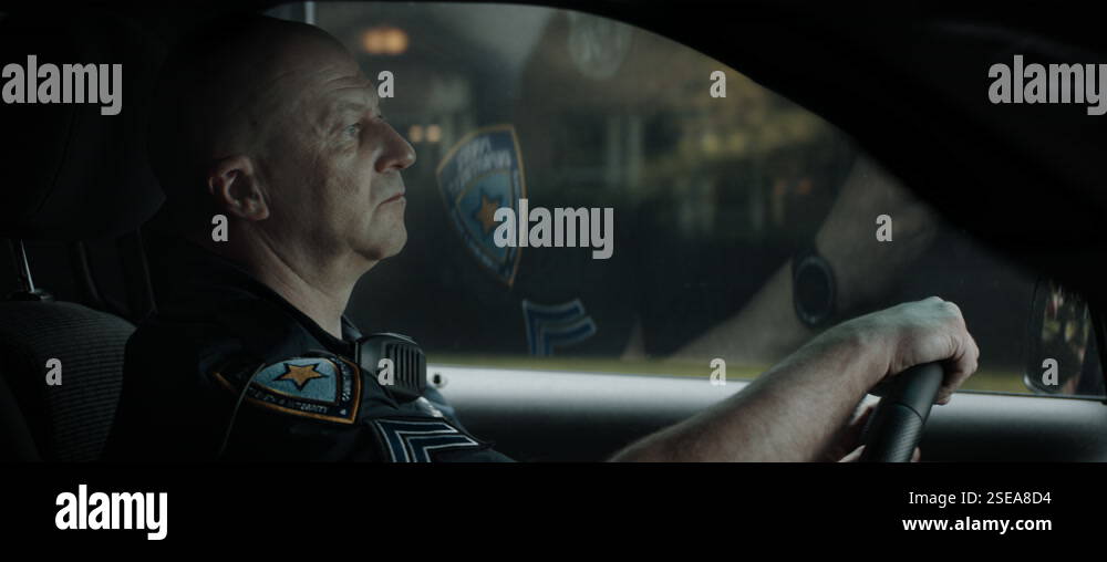 CU Caucasian police officer patrolling streets of neighborhood in ...