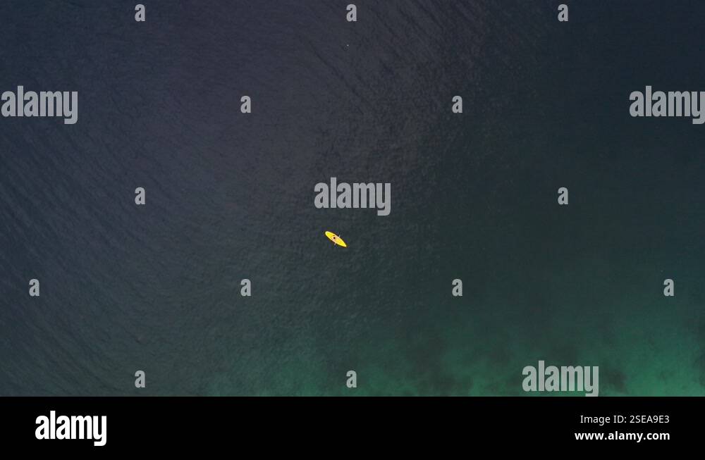 Man Lying On A Kayak Boat Floating On Serene Ocean Of San Pablo Island ...