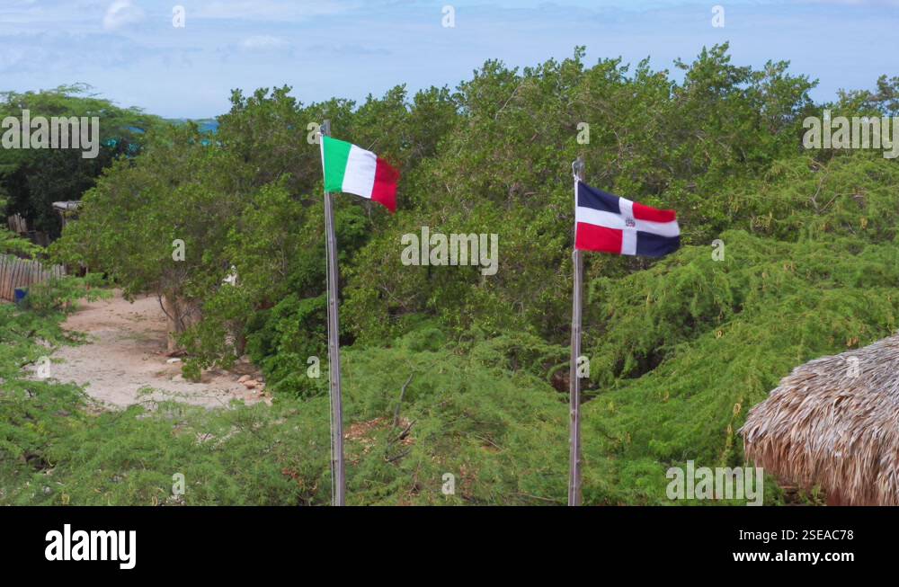 Dominican Republic and Italy flags wave together in the wind ...