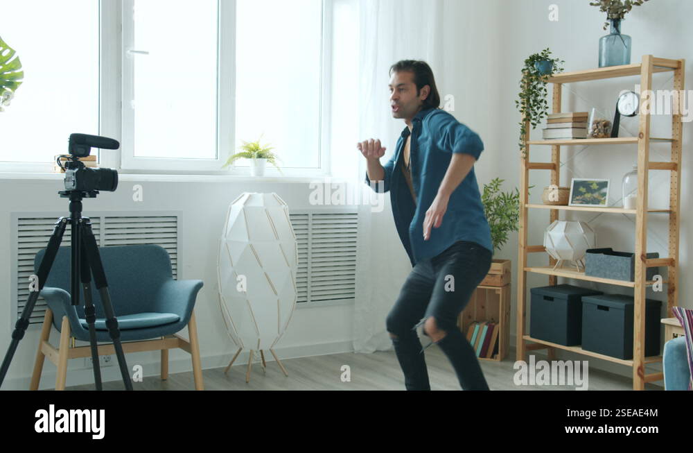 Cheerful guy professional dancer recording video for online vlog ...