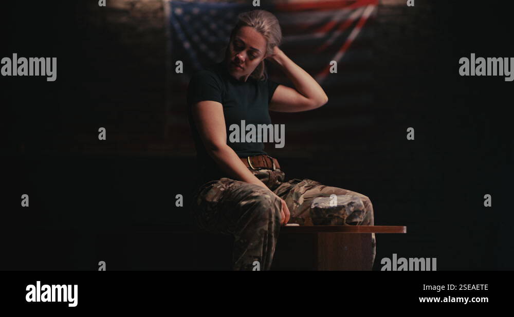 Tired female soldier resting on bench Stock Video Footage - Alamy