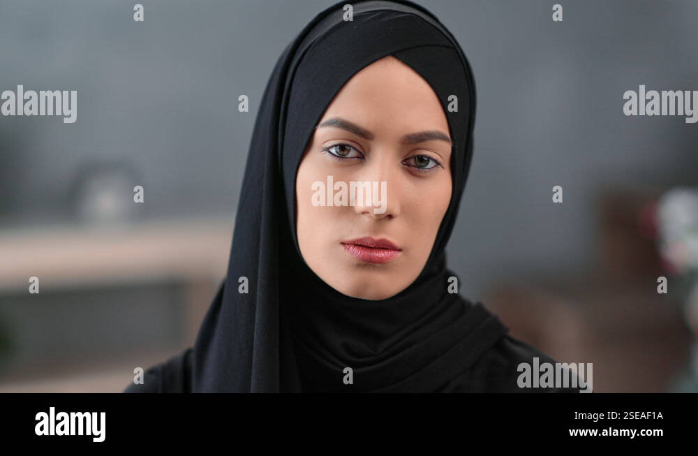 Close up face beautiful Turkish woman wearing black hijab posing at ...