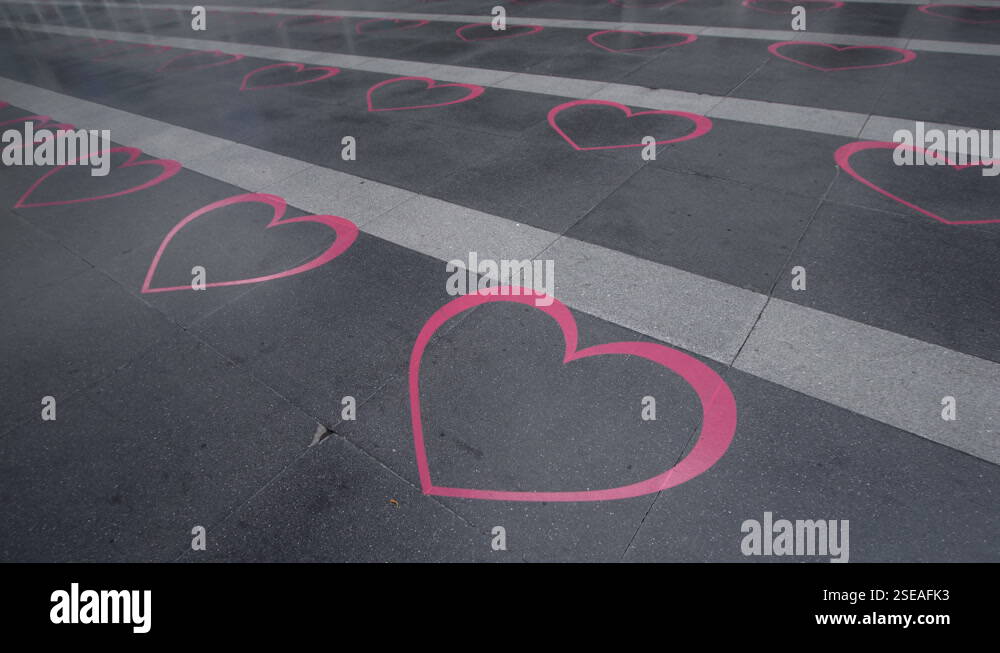 Heart stickers social distancing marks on floor Stock Video Footage - Alamy