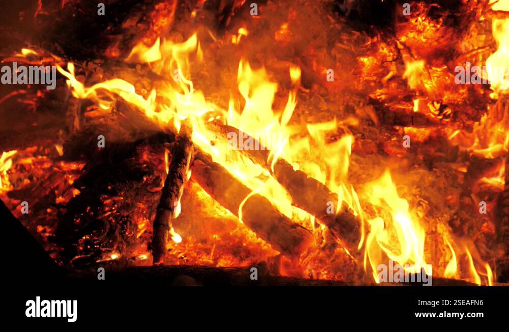 Burning flames of fire in night. The big fire background. Campfire from ...