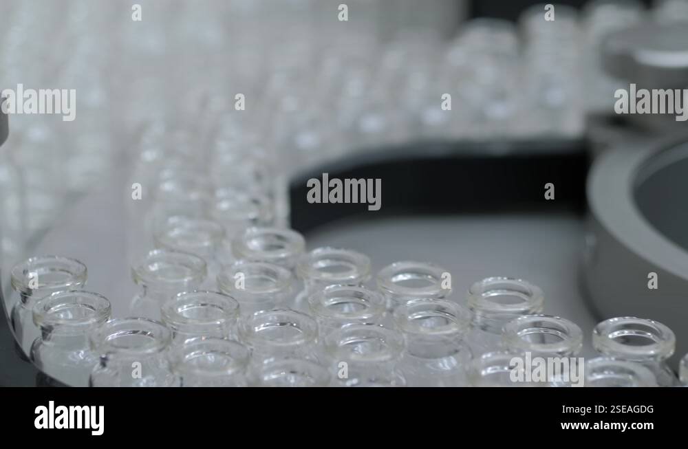 Conveyor with empty medical injection glass vials - production line ...