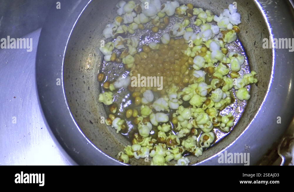 Making popcorn in pot, corn popping Stock Video Footage - Alamy