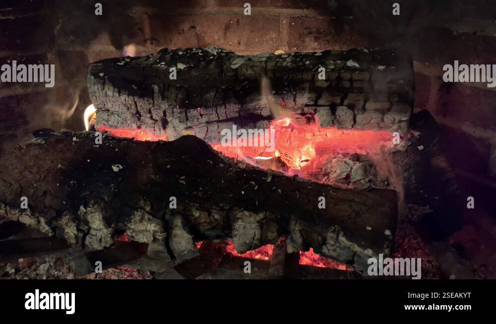 Close up burning embers log fire Stock Video Footage - Alamy