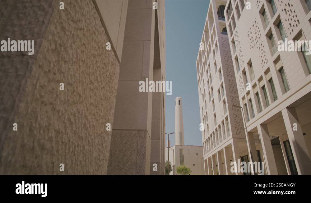 Doha Qatar - Camera tracking next to a building qall with modern ...