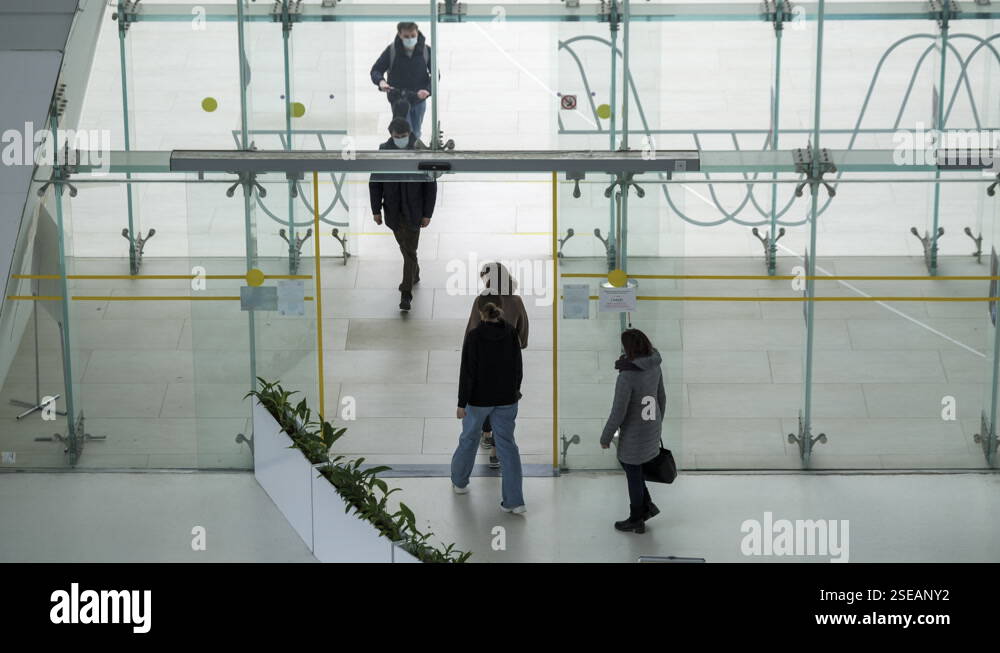 People entering and leaving modern building Stock Video Footage - Alamy