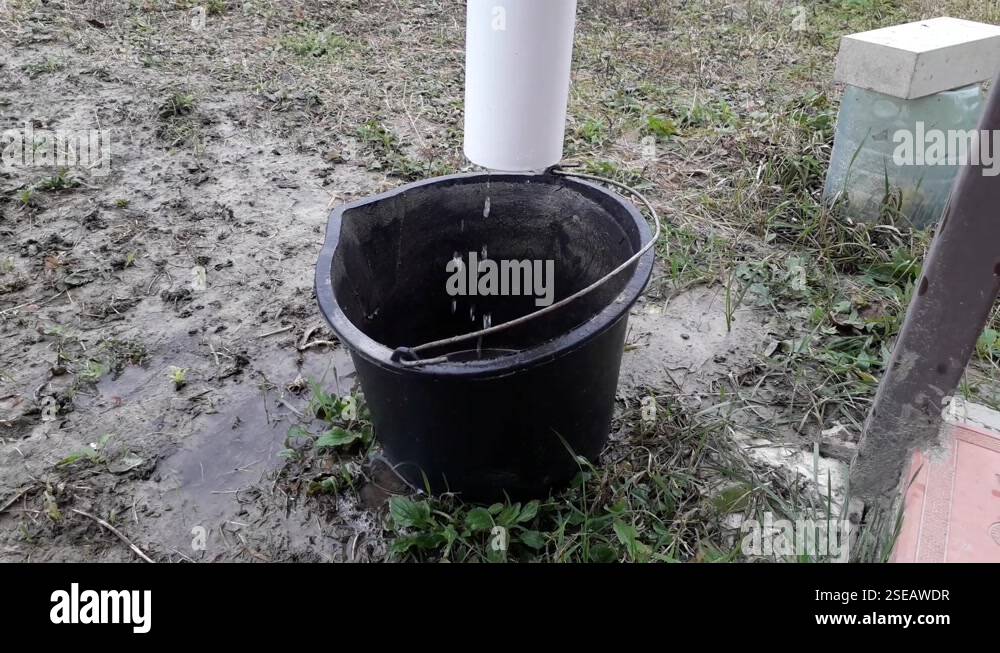 Water drips from the drain during rain Stock Video Footage - Alamy