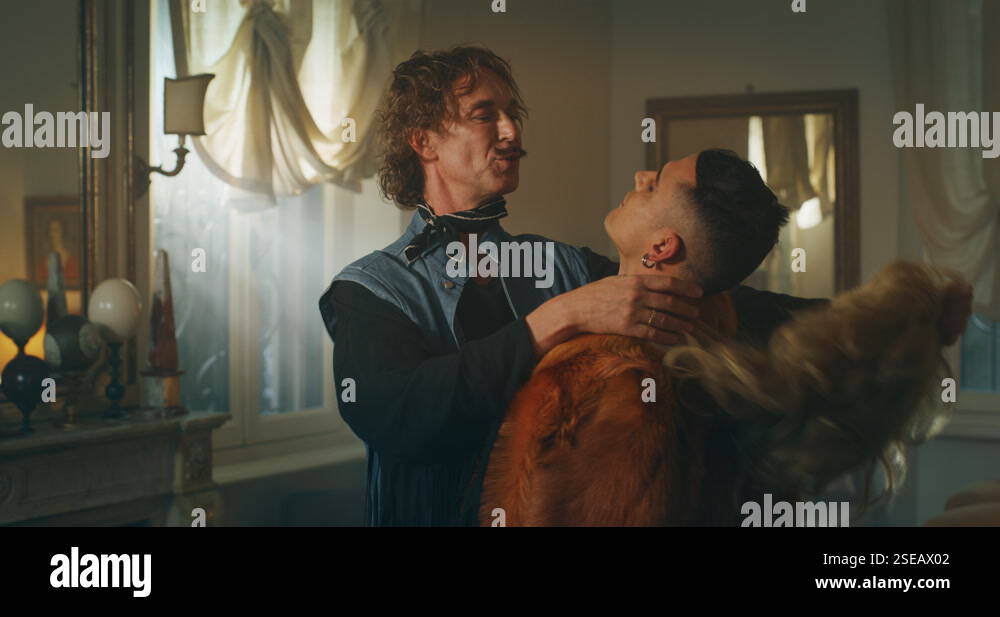 Homosexual male gay taking off wig of transgender woman partner and ...