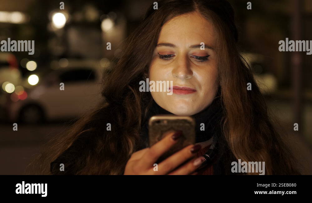 communication, social-girl scrolls the keyboard of mobile to read the ...