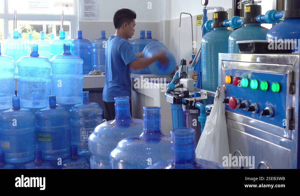 Cleaning and preparing containers in a Water Refilling Station in the ...