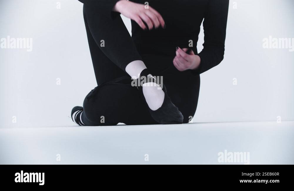 Young woman ballerina takes off her pointy shoes Stock Video Footage ...