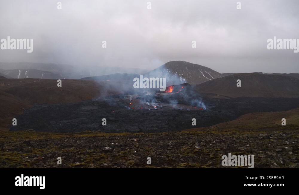 Smoking erupting volcano near Fagradalsfjall, Iceland with spraying ...