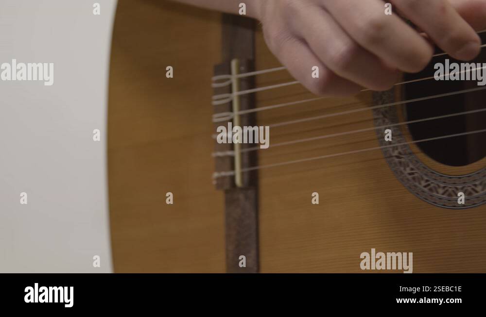 Tracking Shot Past Musicians Hand Playing Acoustic Guitar Stock Video ...