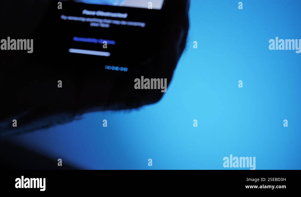 hacker male wearing a white mask trying to fool the Face ID facial ...