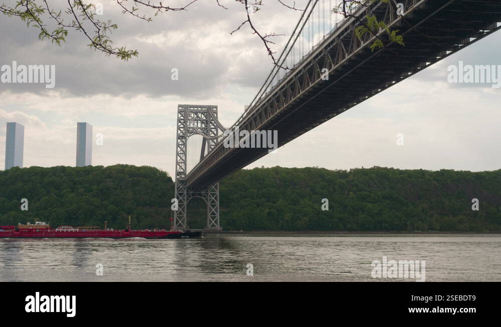 Red barge makes its way under the GW Bridge as it head up the Hudson ...