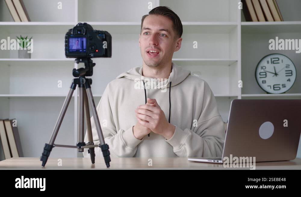 Young blogger man filming new vlog video with professional camera at ...