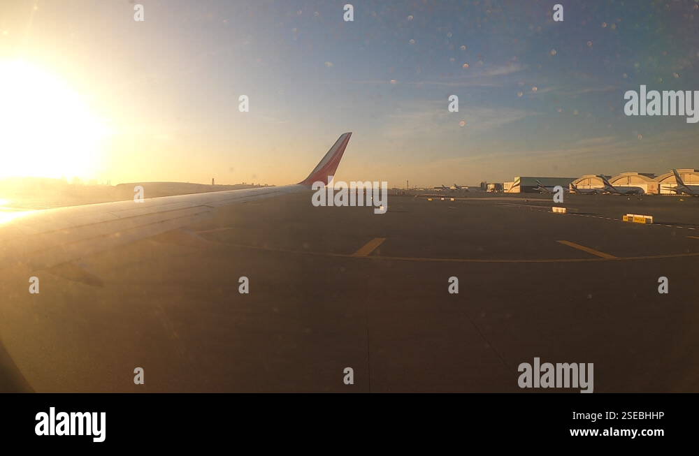4k timelapse shot of the runway track from an aeroplane window. In ...