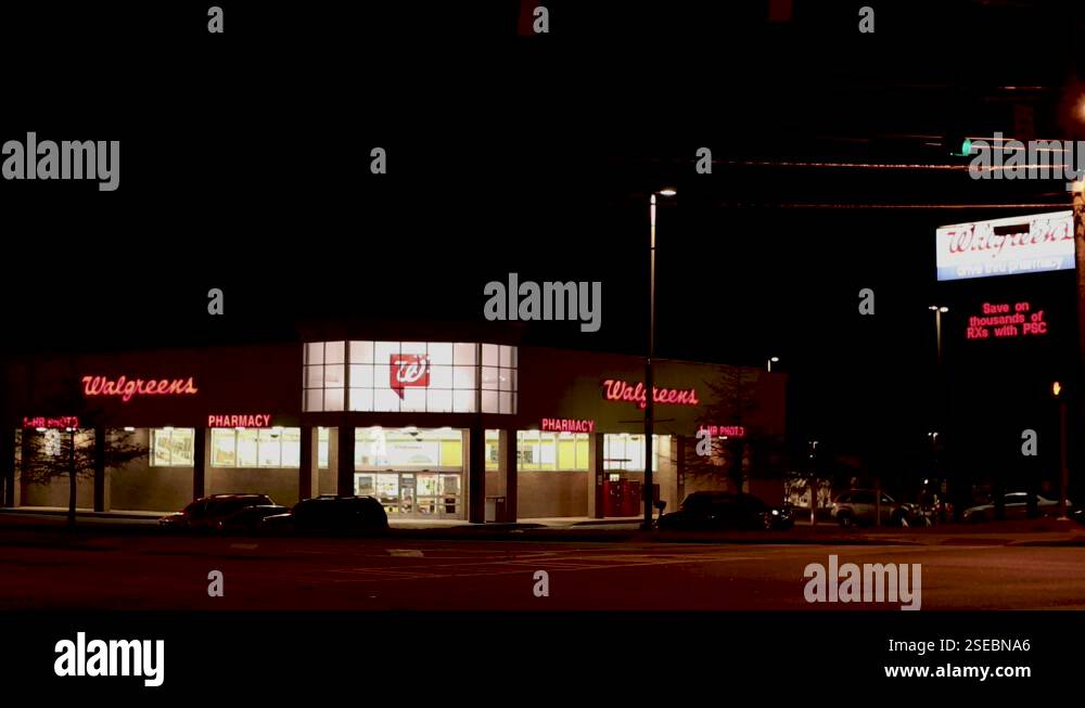 Urban scene - Traffic late at night Walgreens retail store and pharmacy ...
