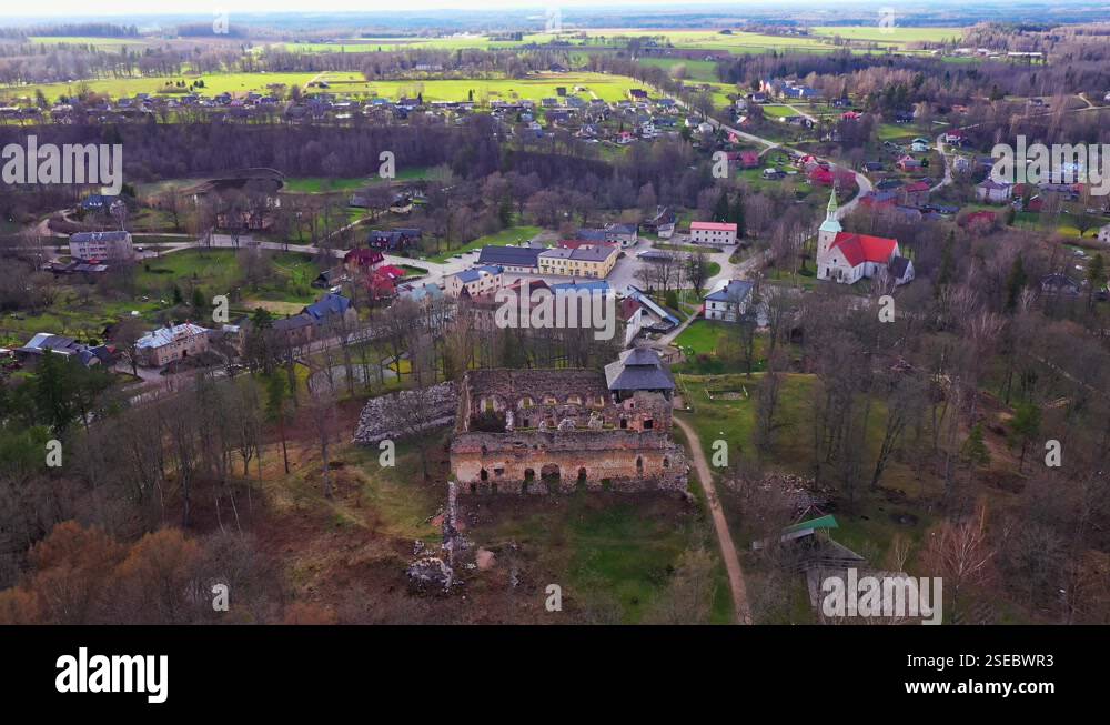 Ruins Of Rauna Castle Near The Village Of Rauna In Latvia. - aerial ...
