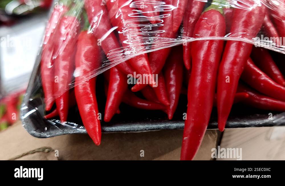 Stack of red pepper in grocery store. Industry of selling products ...