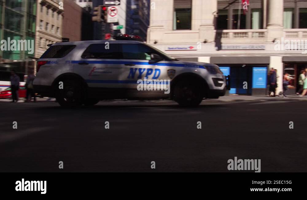 Police car of the New York Police Department moving on the Fifth Avenue ...