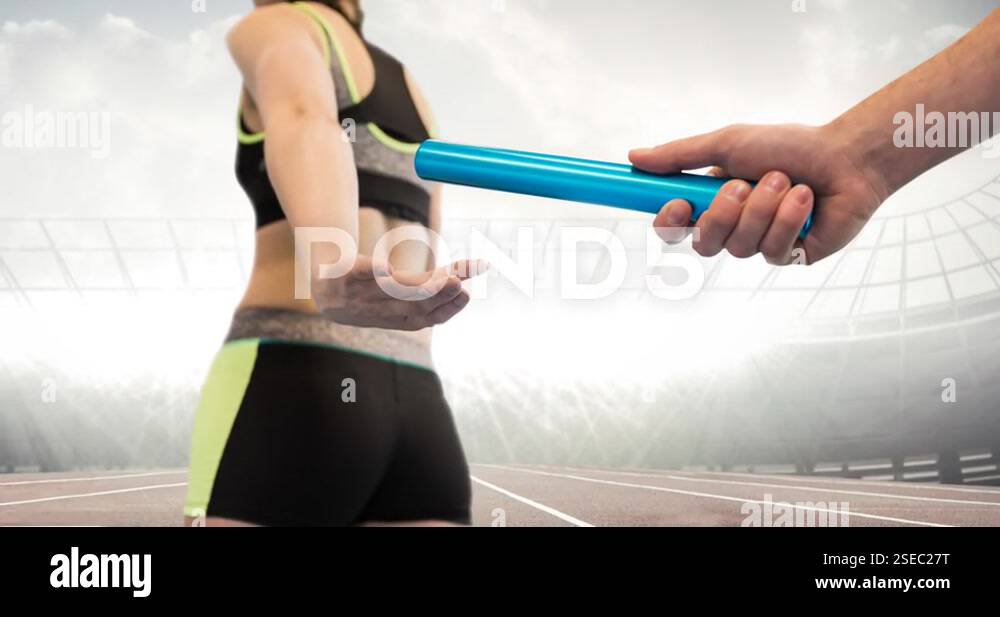 Animation of athlete's hands passing relay baton over sports stadium ...