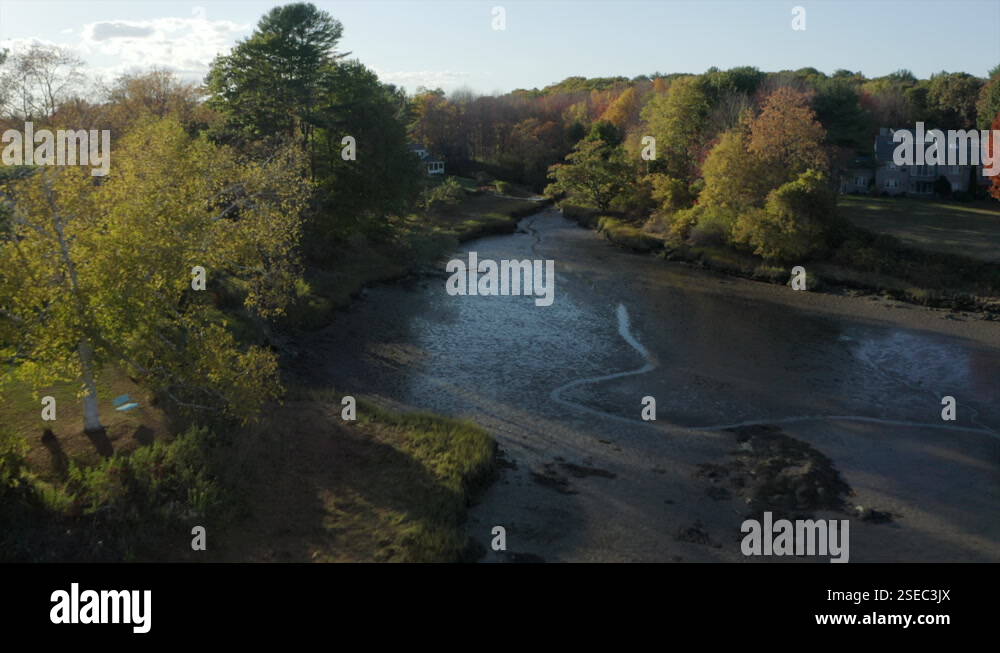Aerial Moving Forward Over A Secluded Harbor Inlet With Stately Homes ...