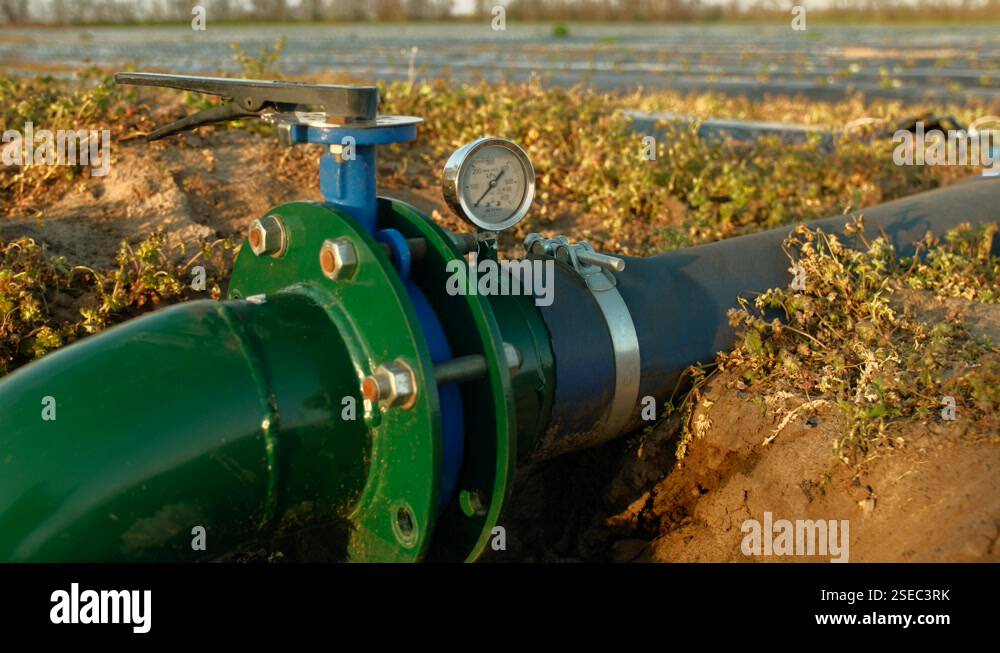 Irrigation pipe system with water meter on large field Stock Video ...