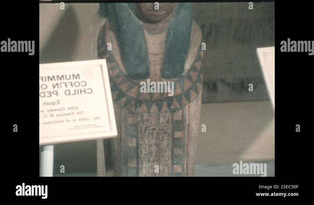 1970s: Exterior decorated Egyptian Mummy sarcophagus. Small mummified ...
