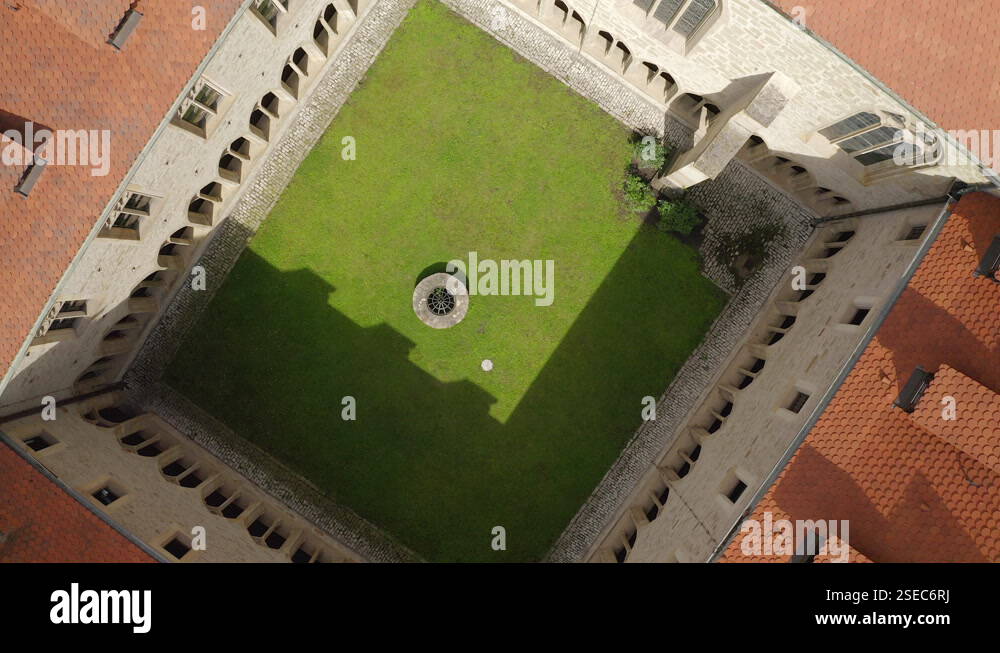 Aerial of Directly Above And Spinning Out Of The Courtyard Of An Old ...