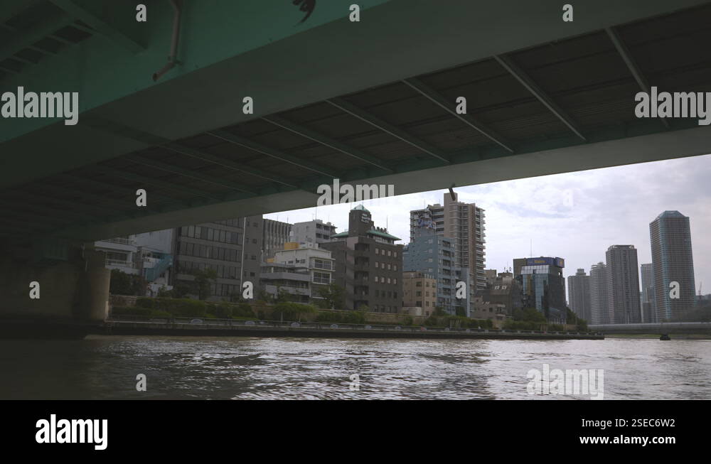Going under the bridge in Tokyo Japan across the water channel Stock ...