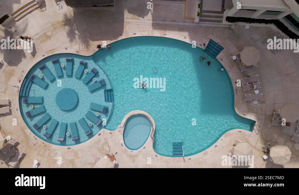 Tourist Swimming in Hotel Pool - Aerial Overhead Top Down View Stock ...
