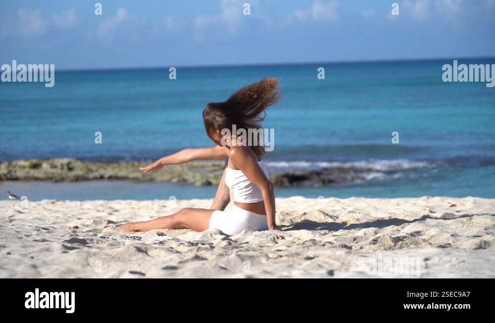 Young flexible fit woman dancing on the beach with sand in slow motion. Freedom Stock Video ...
