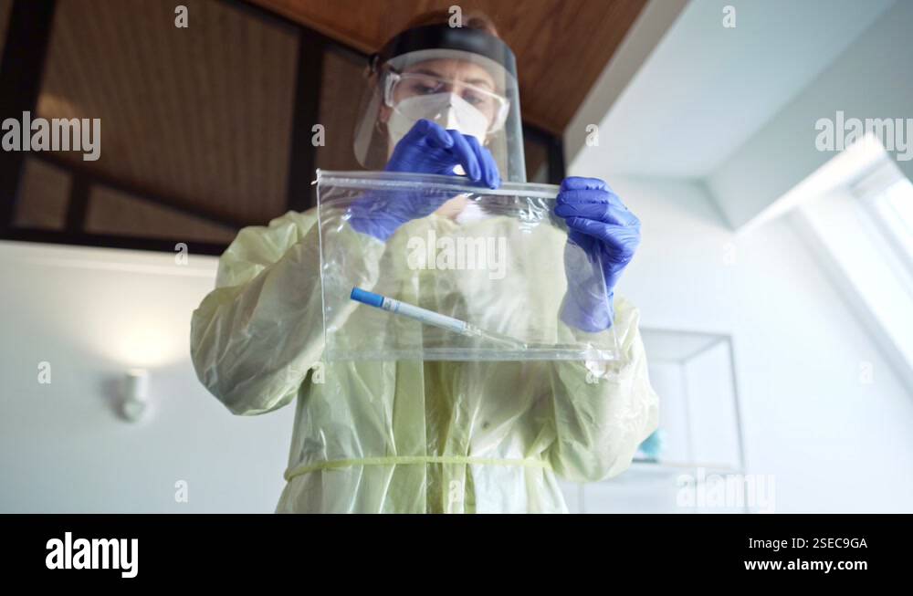 Healthcare worker putting nasal swab in plastic bag Stock Video Footage ...