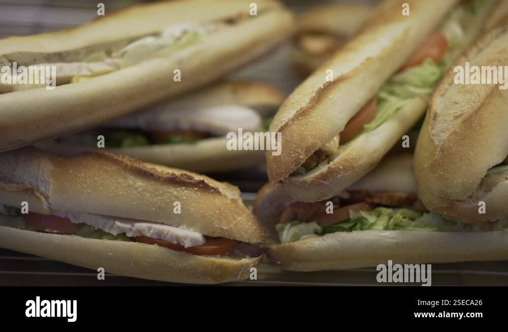 Sandwiches on display at store through glass window. Sandwich Stock ...