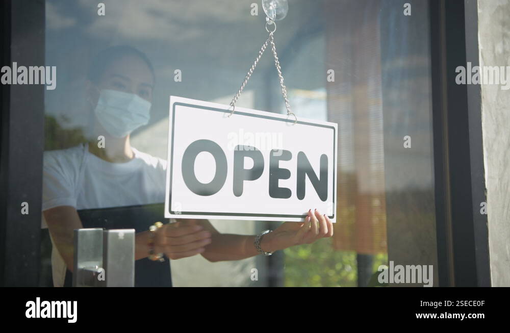 Coffee shop concept of 4k Resolution. A female employee is preparing to ...