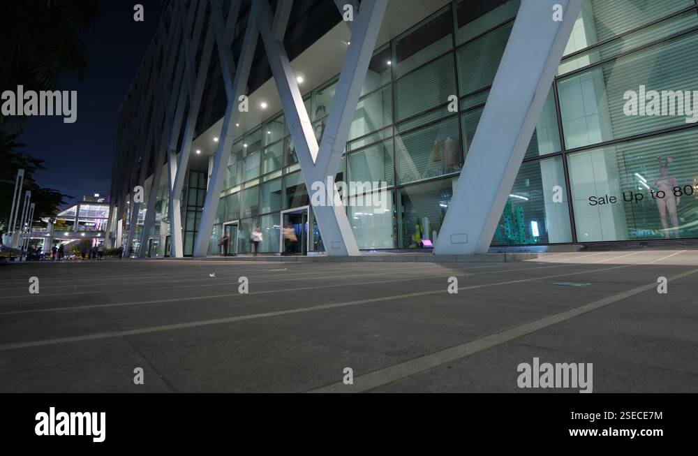 Time lapse shot, people walk at pavement against CentralWold shopping ...