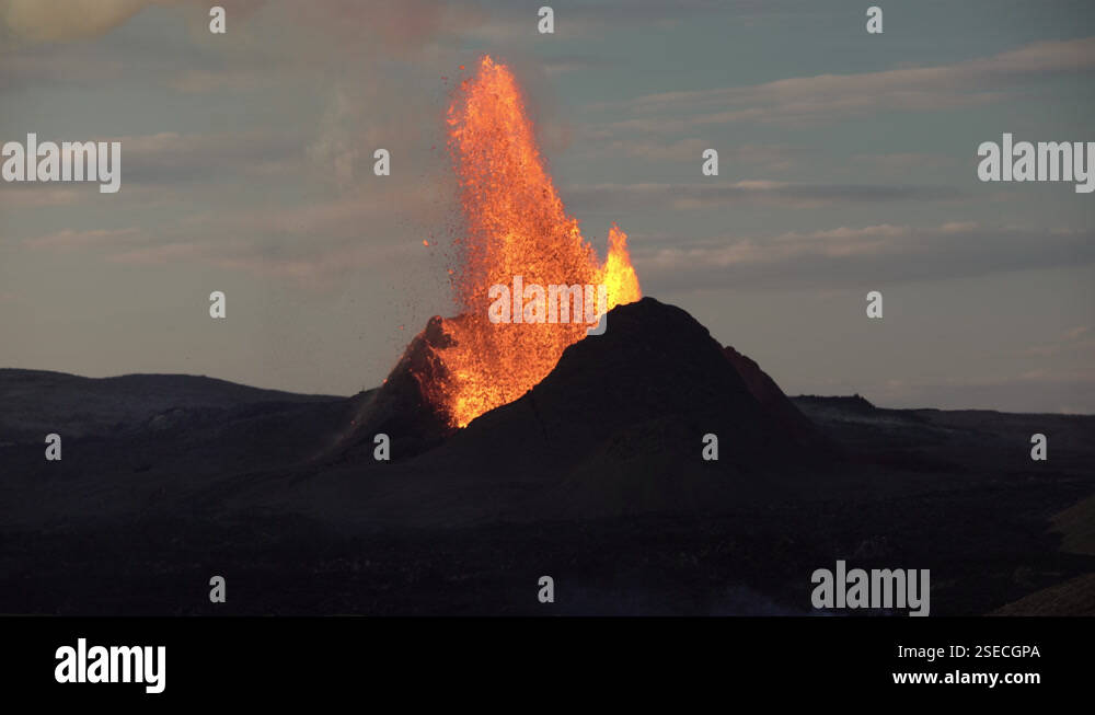 Airplane flying over powerful volcanic eruption Iceland day Stock Video ...