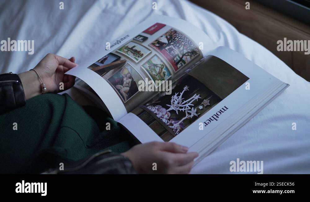 Woman Reading and Flipping Through Magazine, Sitting on Bed - Cinematic ...
