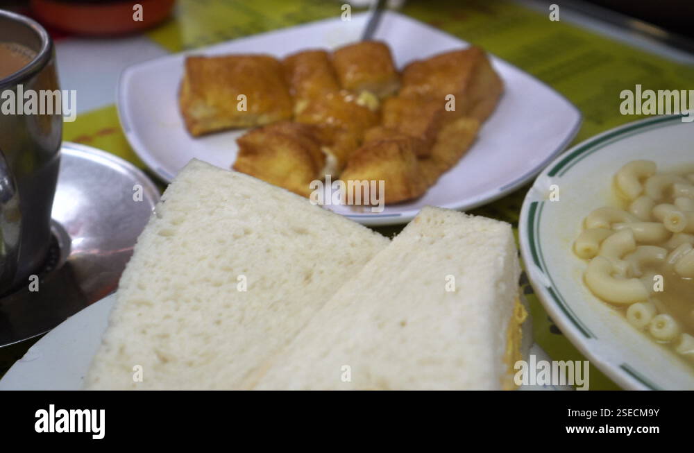 Hong Kong local breakfast set style butter toast, maccaroni soup with ...
