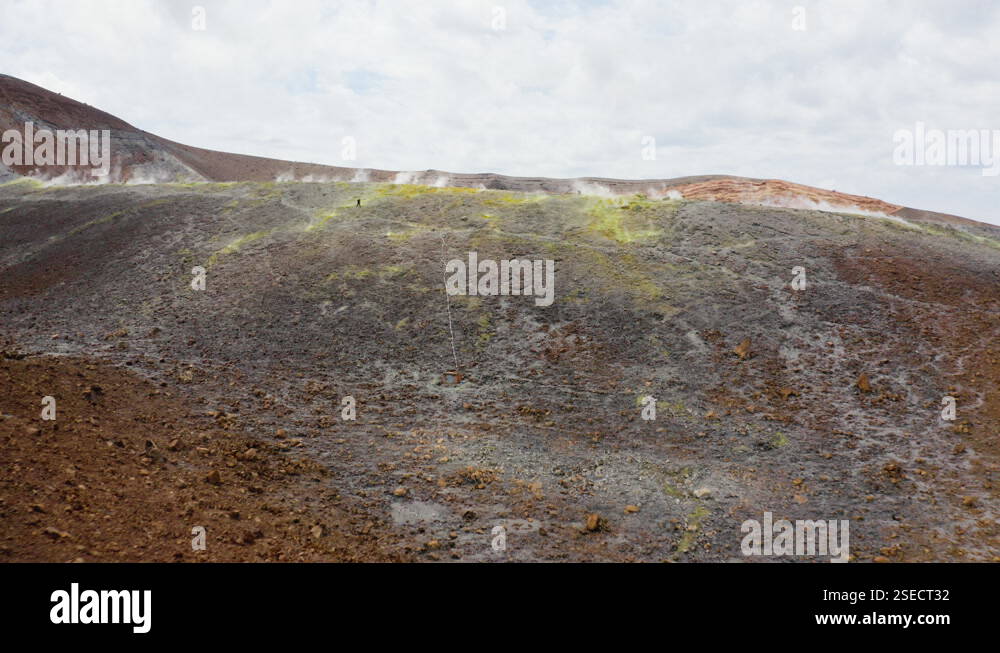 Scientist studying volcano hiking on Volcano Island travel destination ...