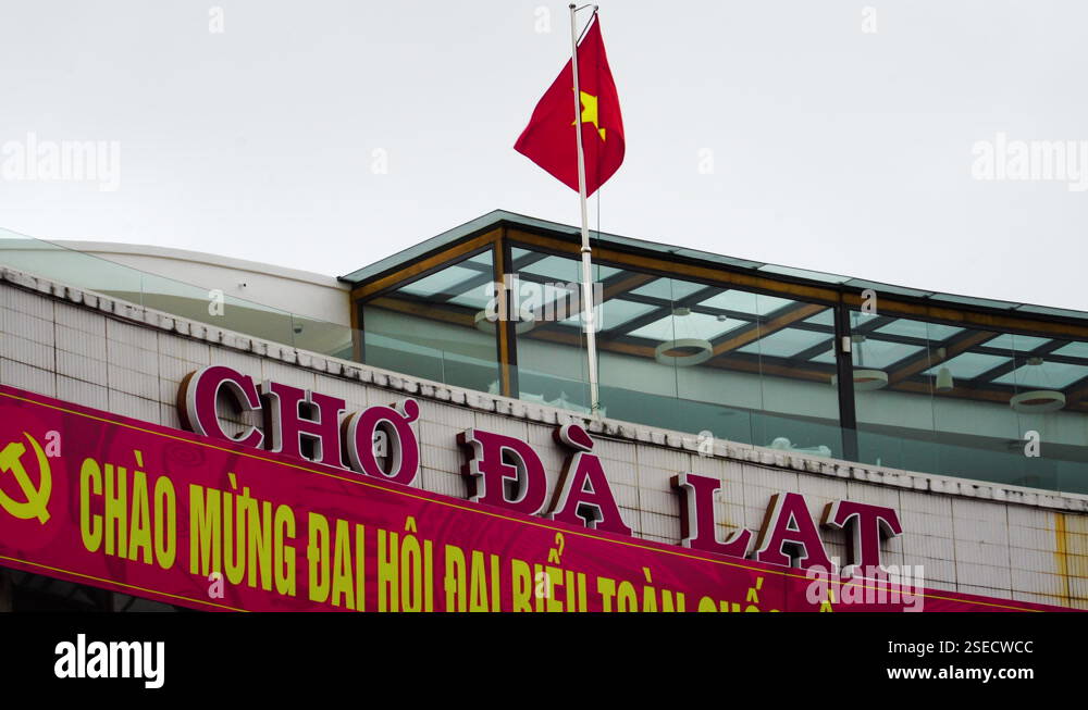Close-up of detail of Da Lat sign with Vietnamese flag and government ...