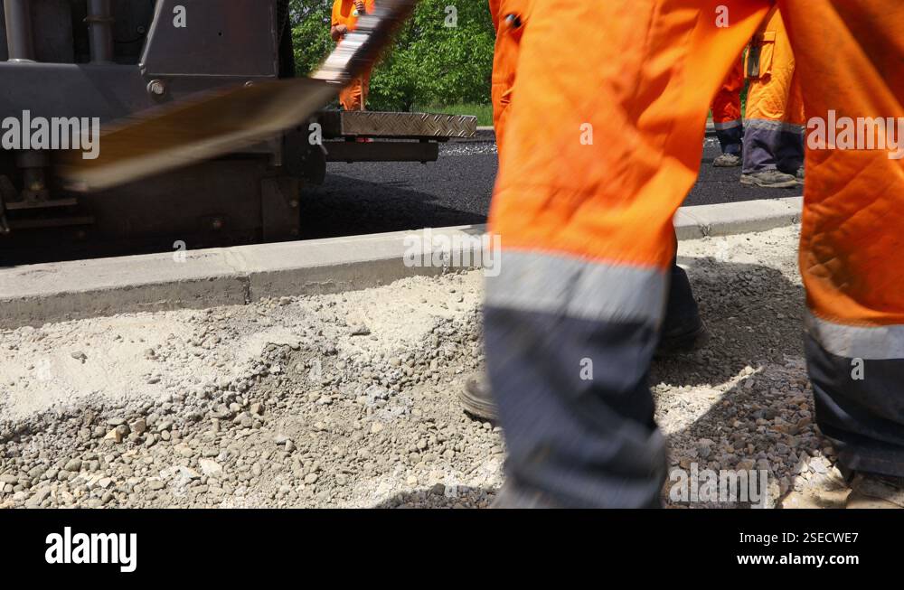 Tarmac road laying machine. Asphalt spreader Stock Video Footage - Alamy