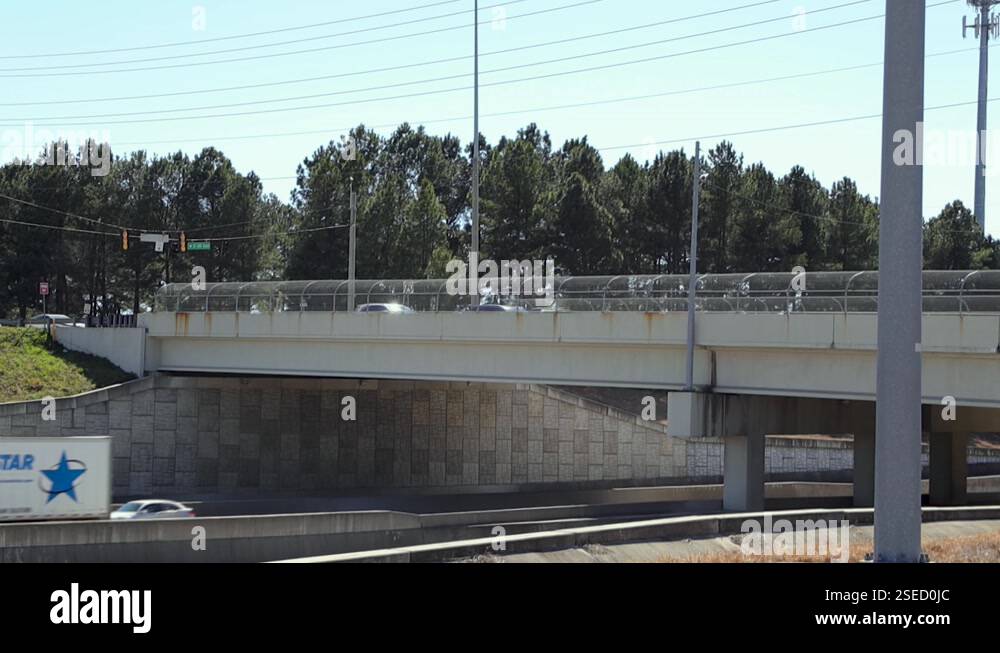 Traffic over and under a modern interstate highway bridge Stock Video ...